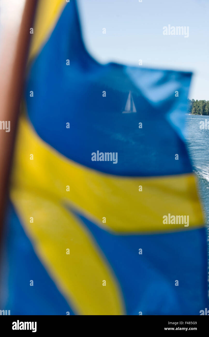 The Swedish flag streaming in the wind, Sweden Stock Photo - Alamy