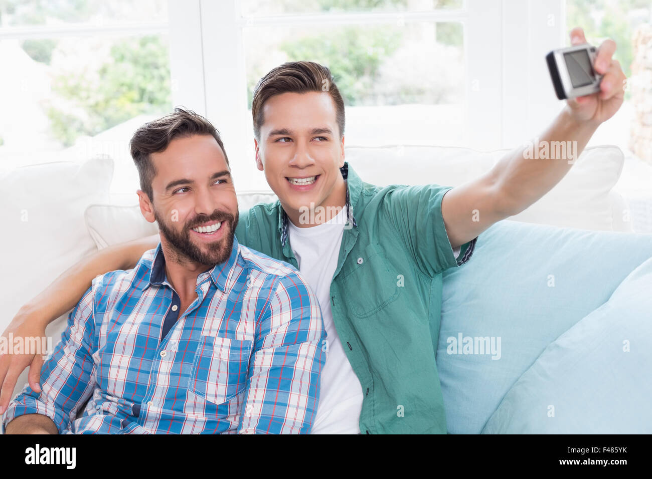 Handsome gay couple taking selfie hi-res stock photography and images ...