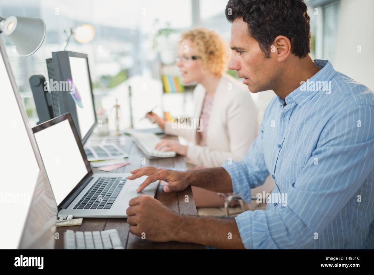 Smiling casual business team working together Stock Photo - Alamy Smiling casual business team working together Stock Photo - Alamy
