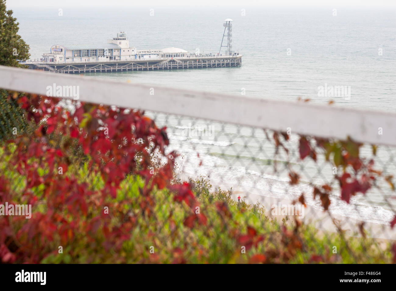 looking down over Bournemouth pier and beach in Autumn with colourful ...