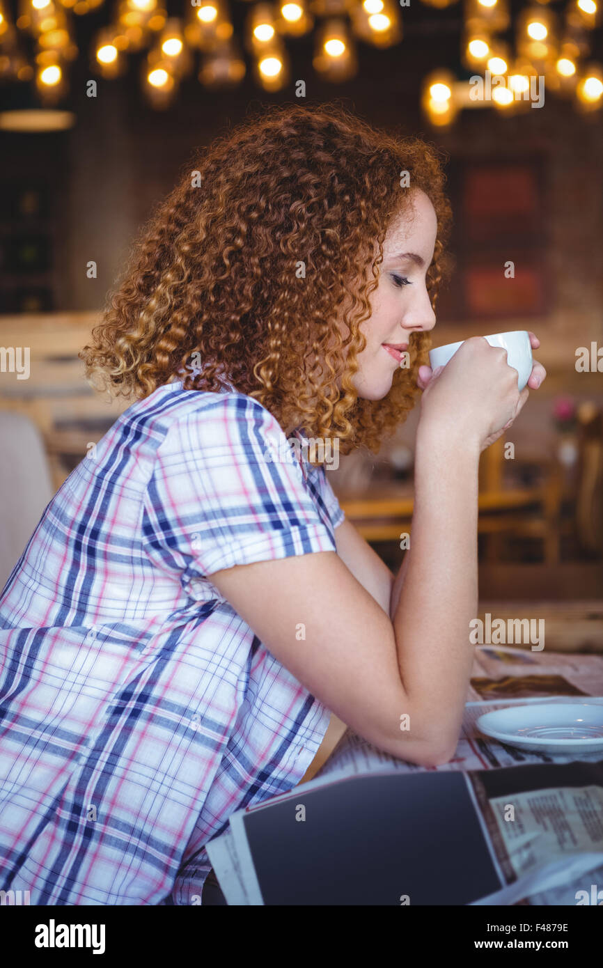 Happy smiling woman drinking coffee Stock Photo - Alamy