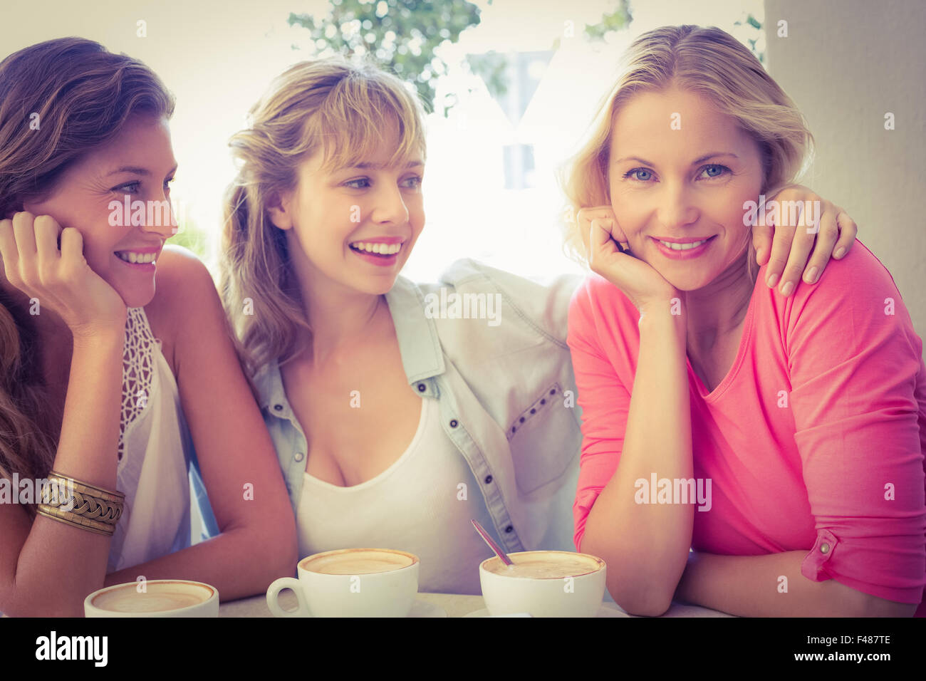 Beautiful women smiling at the camera Stock Photo - Alamy