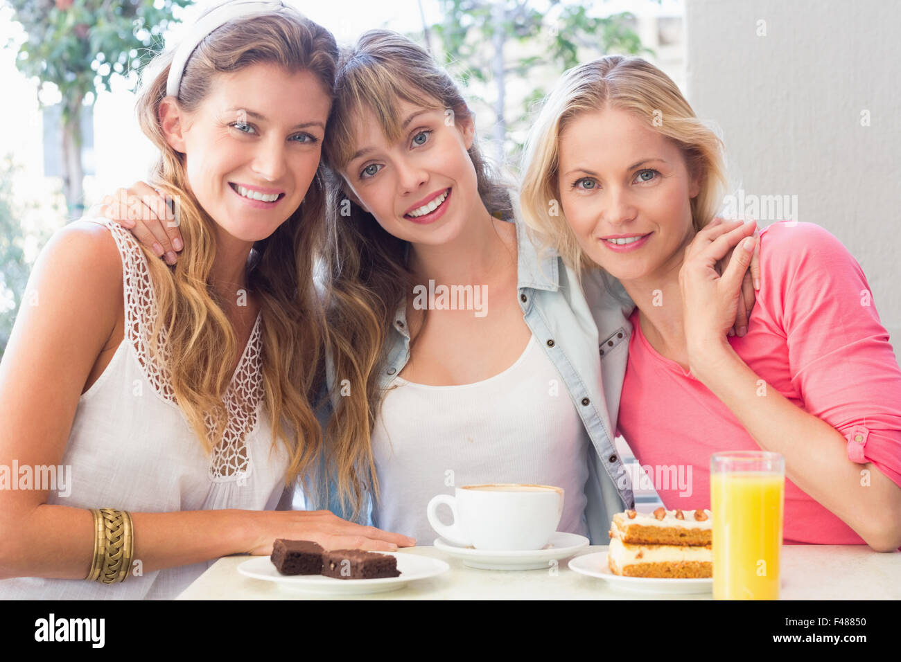 Beautiful women smiling at the camera Stock Photo - Alamy