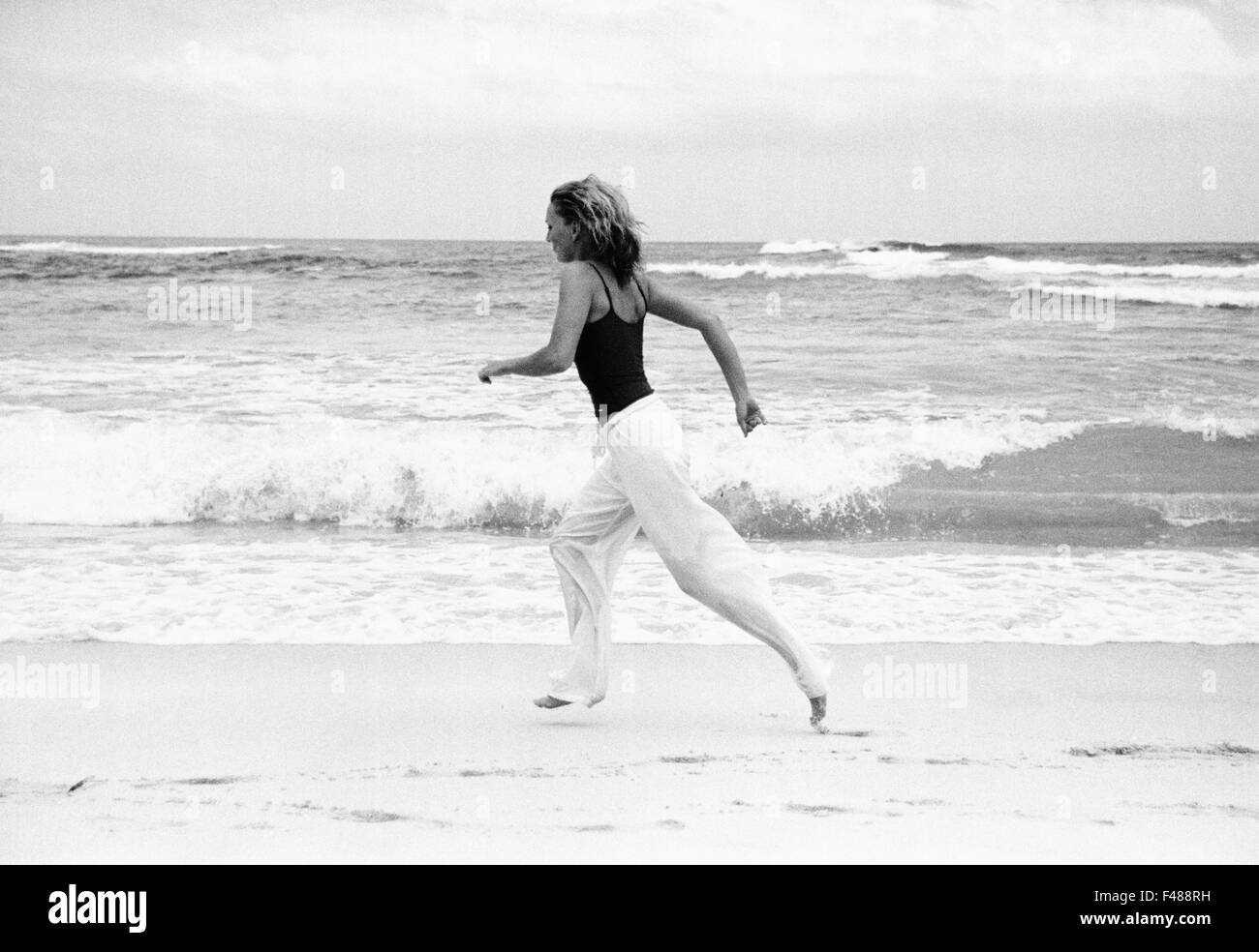 Female model on a beach, Bali Stock Photo - Alamy
