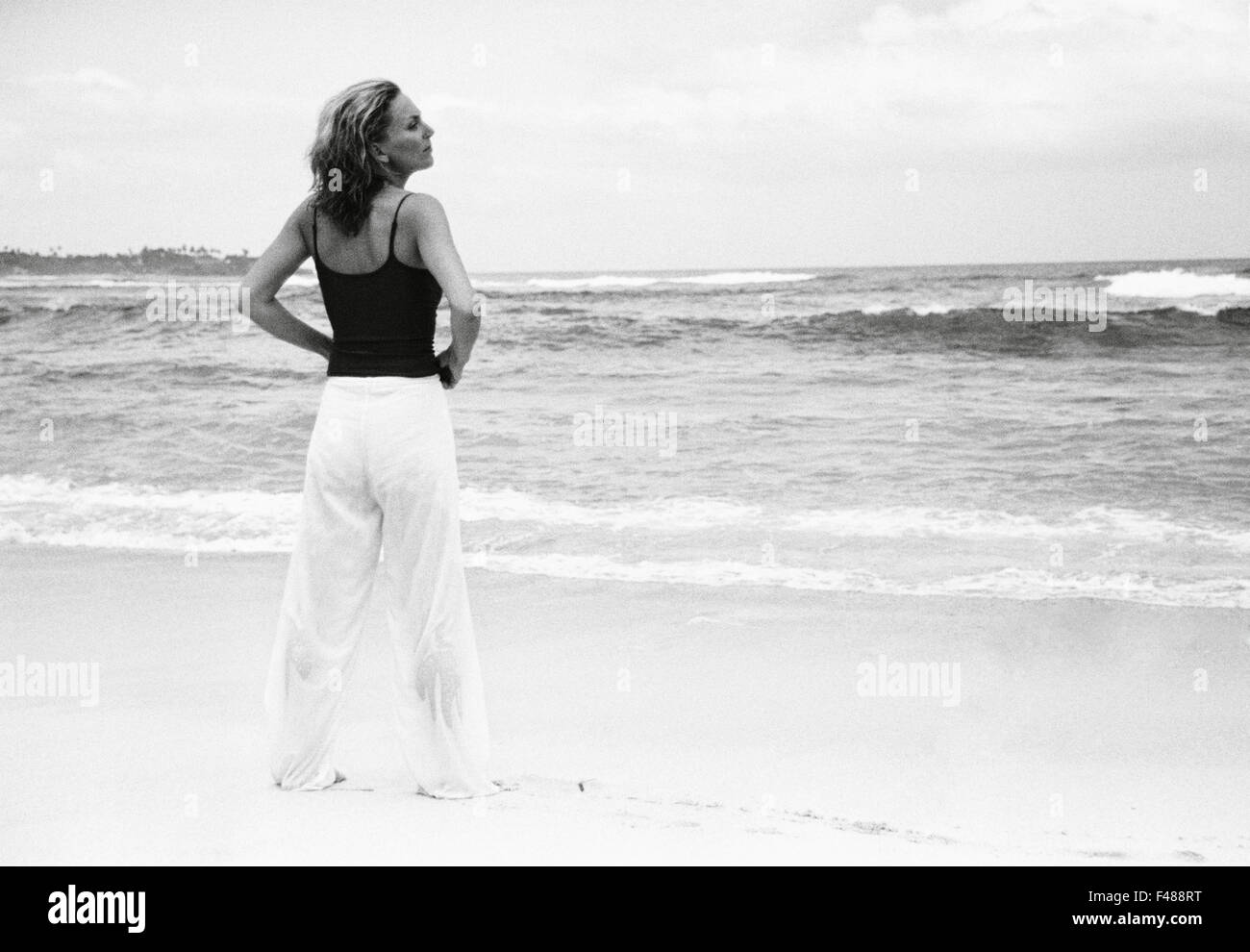 Female model on a beach, Bali Stock Photo - Alamy