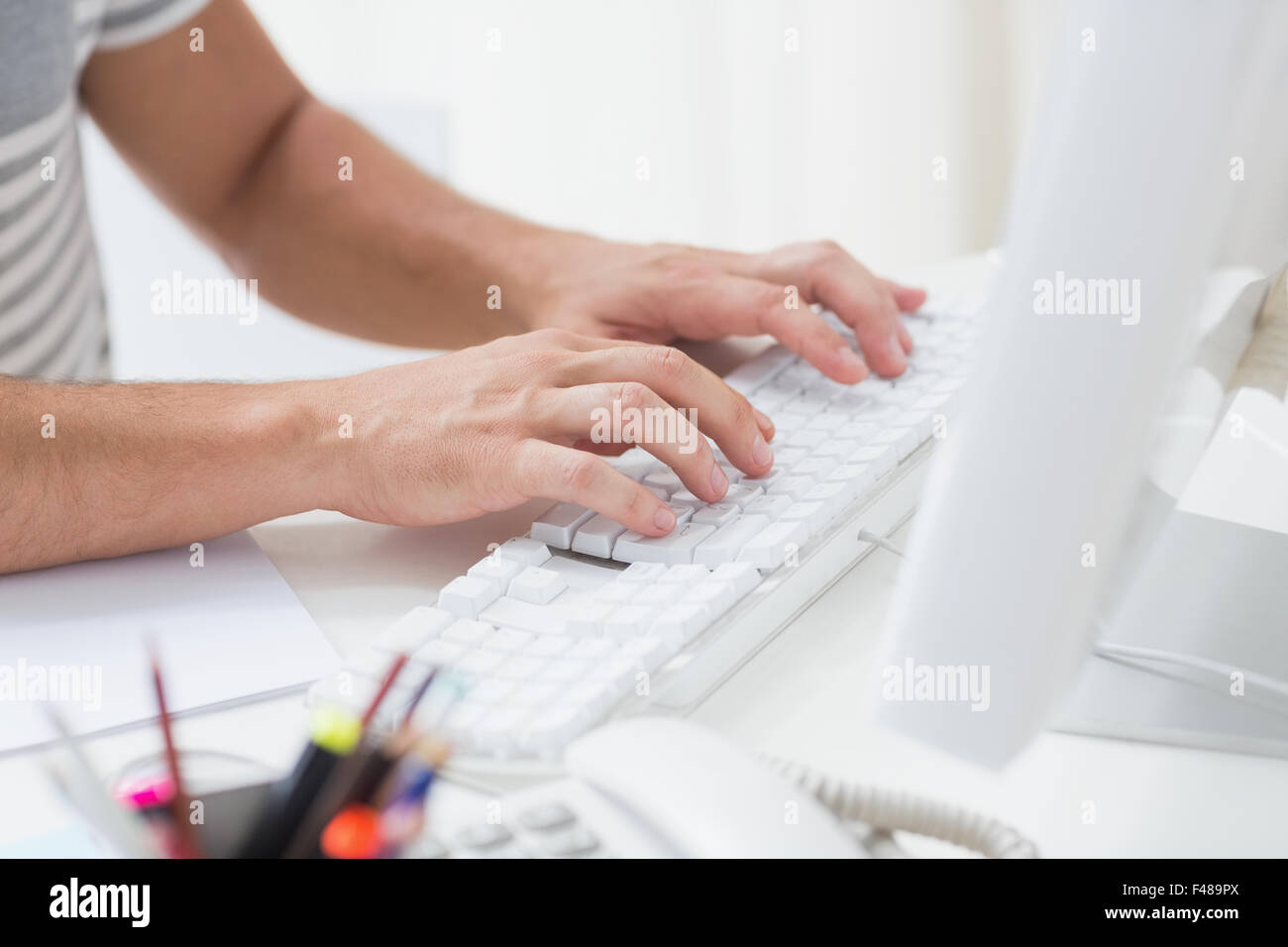 Man typing on computer keyboard Stock Photo - Alamy