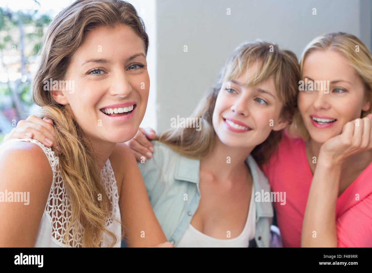Beautiful women smiling at the camera Stock Photo - Alamy