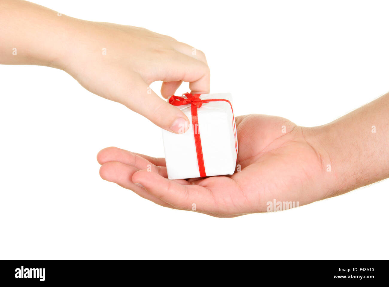 Two hands and box with gift Stock Photo - Alamy