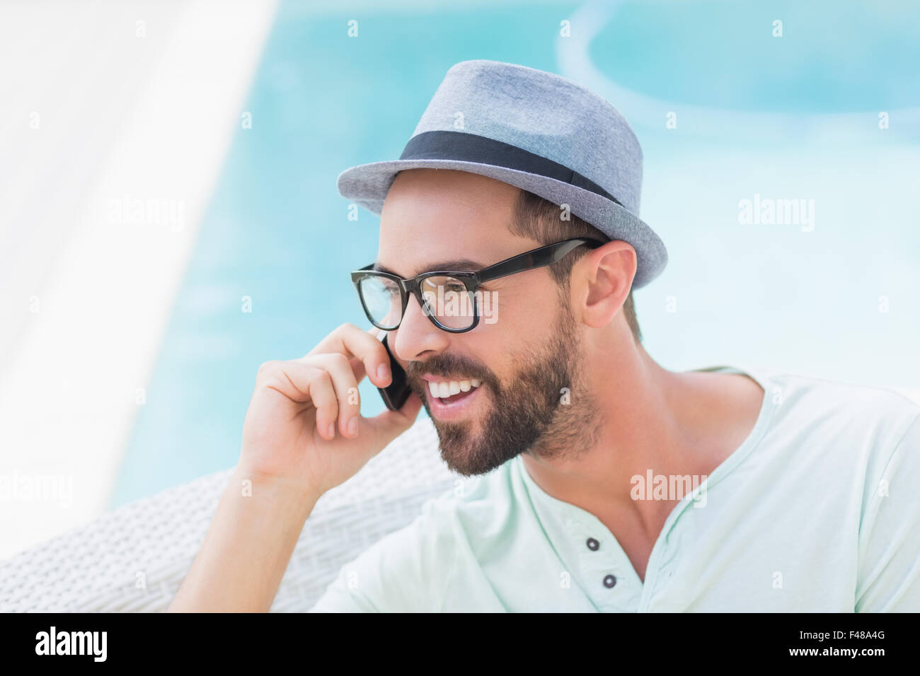 Happy handsome man having phone call Stock Photo - Alamy