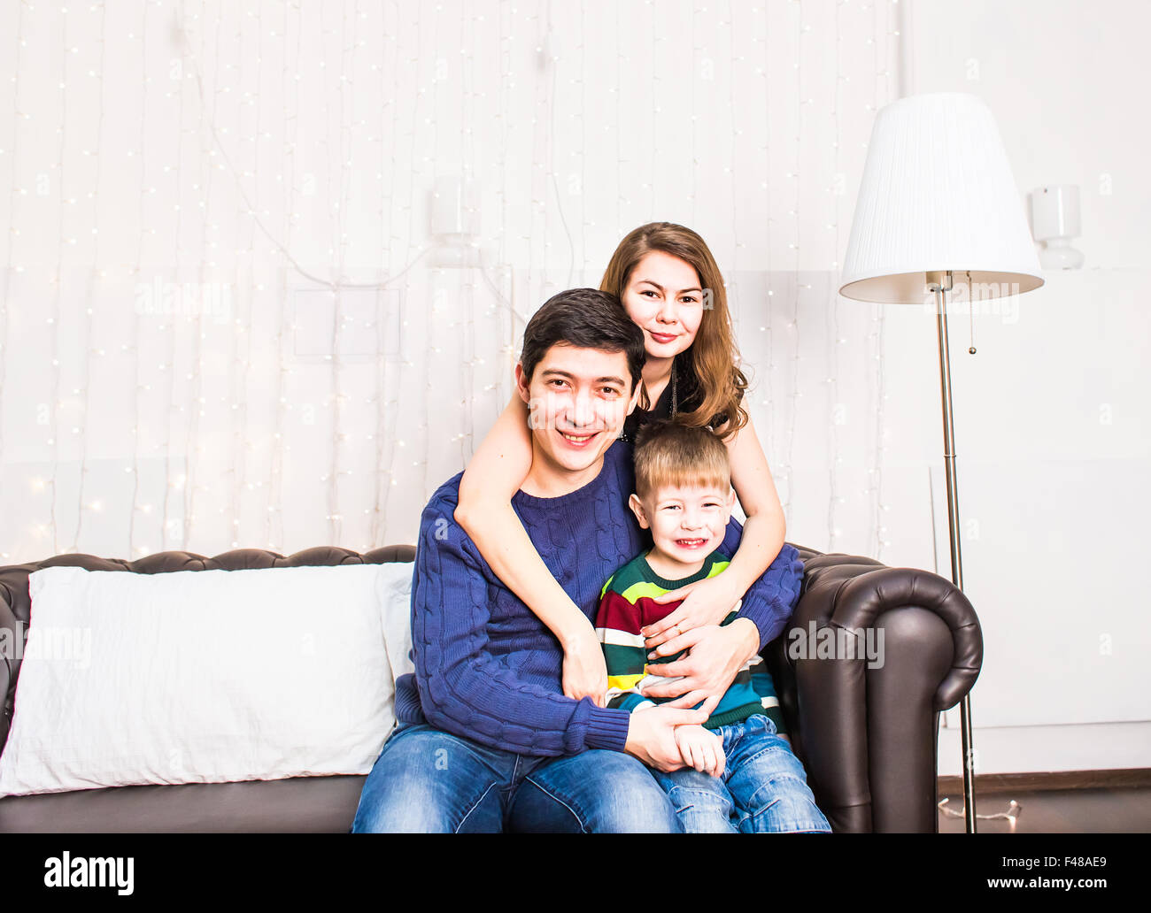 Portrait of a happy family smiling at home Stock Photo - Alamy