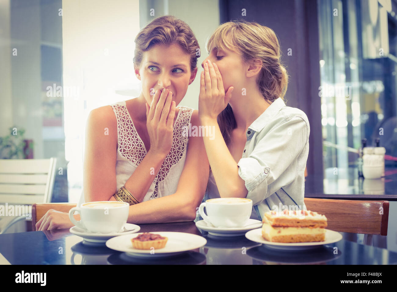 Women women telling secrets hi-res stock photography and images - Alamy