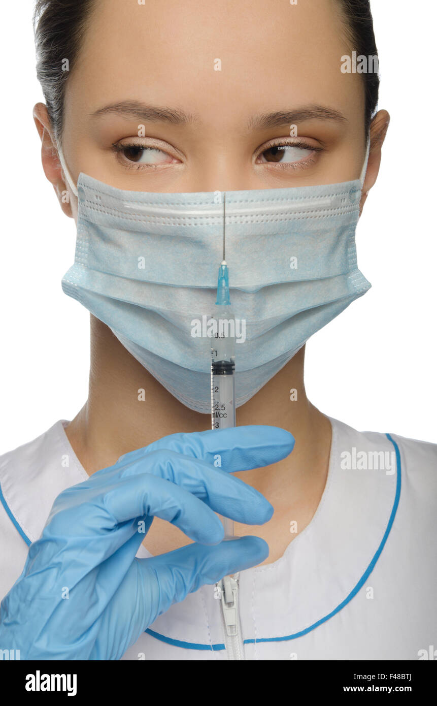 Doctor with syringe looking left Stock Photo - Alamy