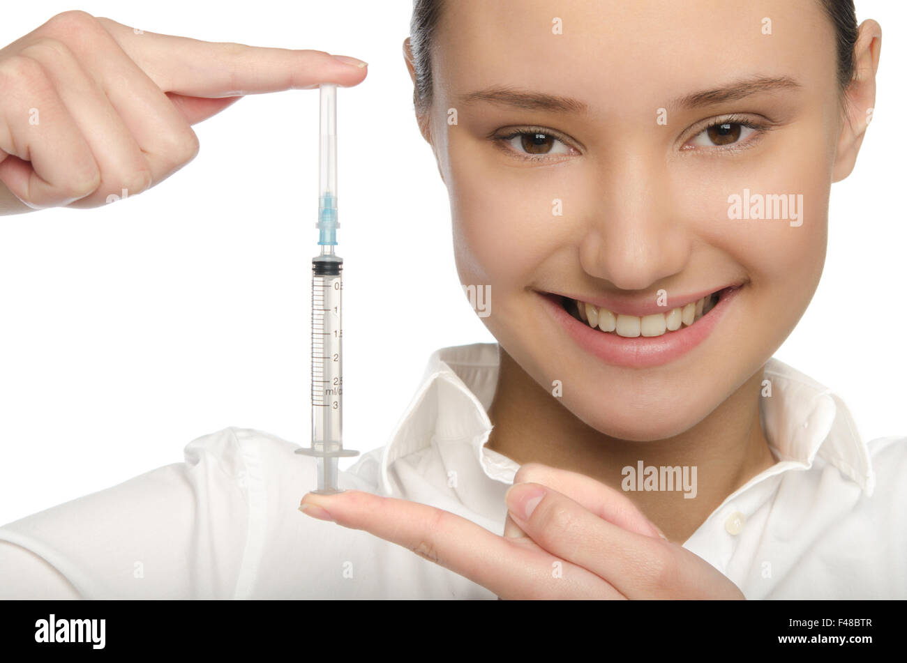 Young doctor shows a syringe Stock Photo - Alamy