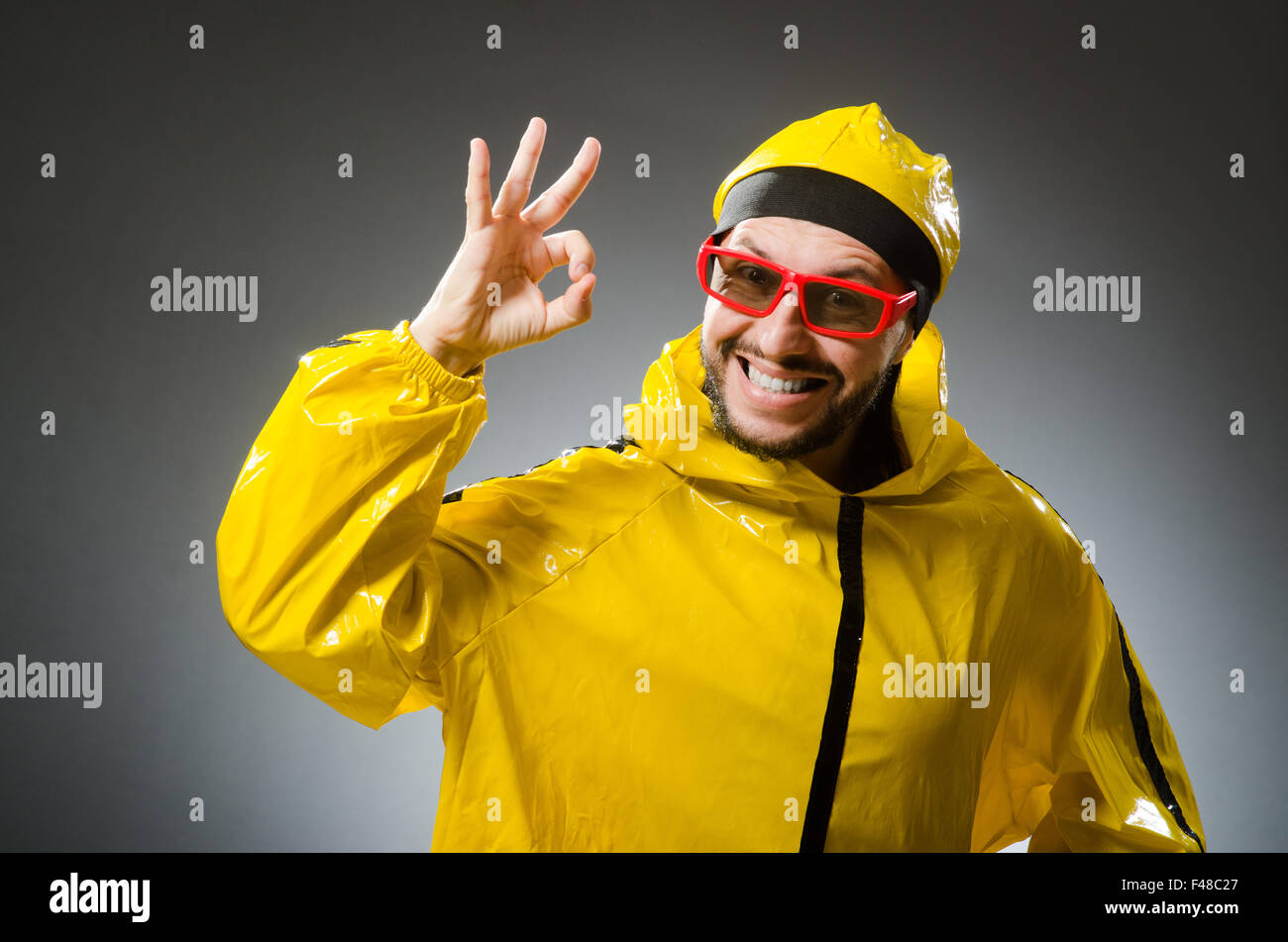 Funny man wearing yellow suit Stock Photo - Alamy