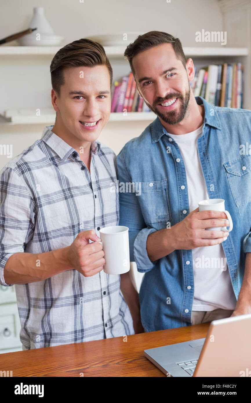 Happy handsome man holding mug hi-res stock photography and images - Alamy