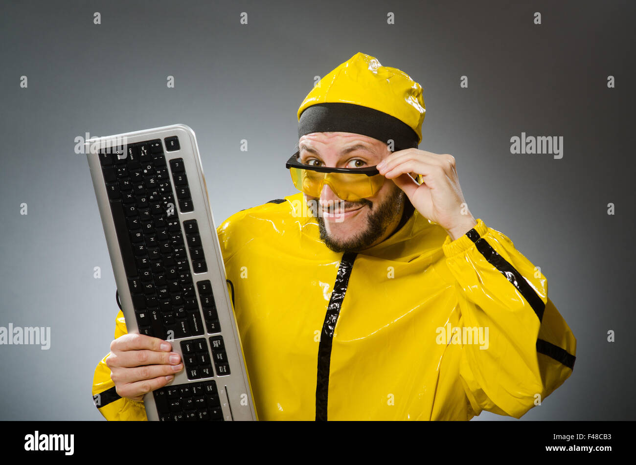 Man wearing yellow suit with keyboard Stock Photo - Alamy