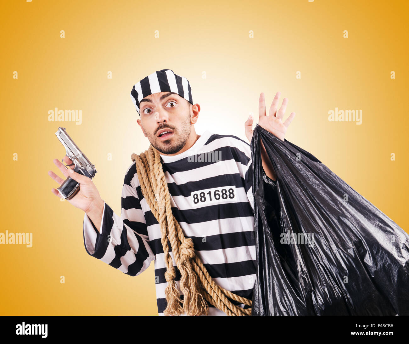 Convict criminal in striped uniform Stock Photo - Alamy