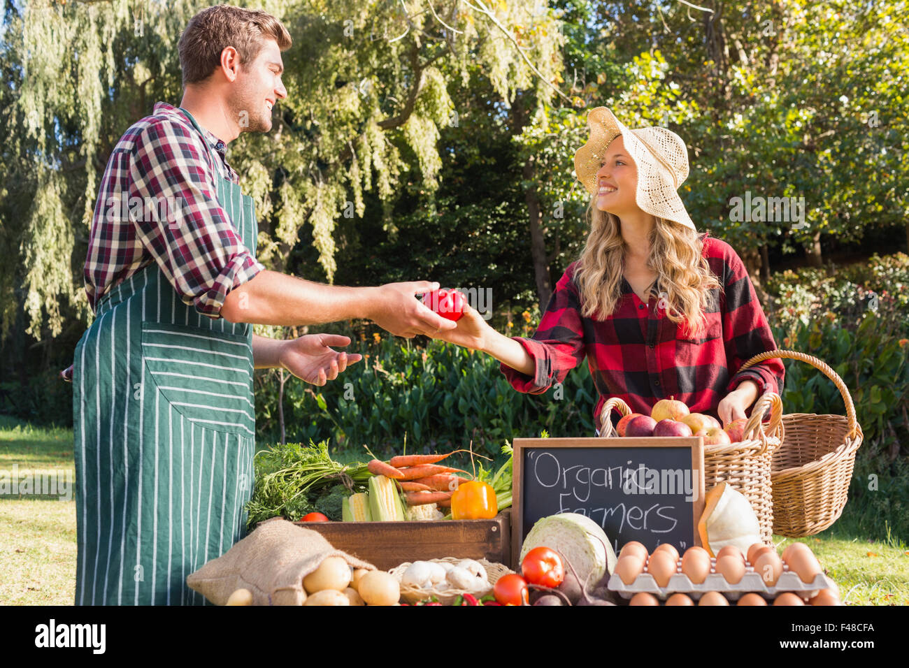 Female farmer giving fresh produce hi-res stock photography and images ...