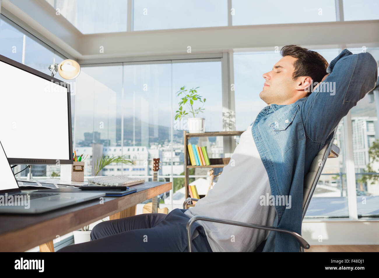 Businessman desk office leaning back hi-res stock photography and ...