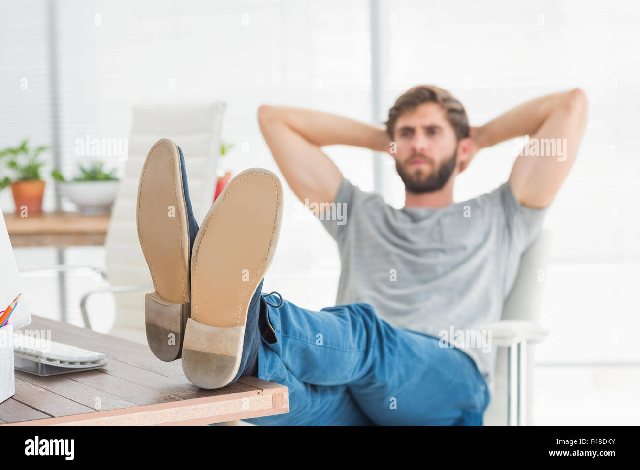 Man sitting desk feet up hi-res stock photography and images - Alamy