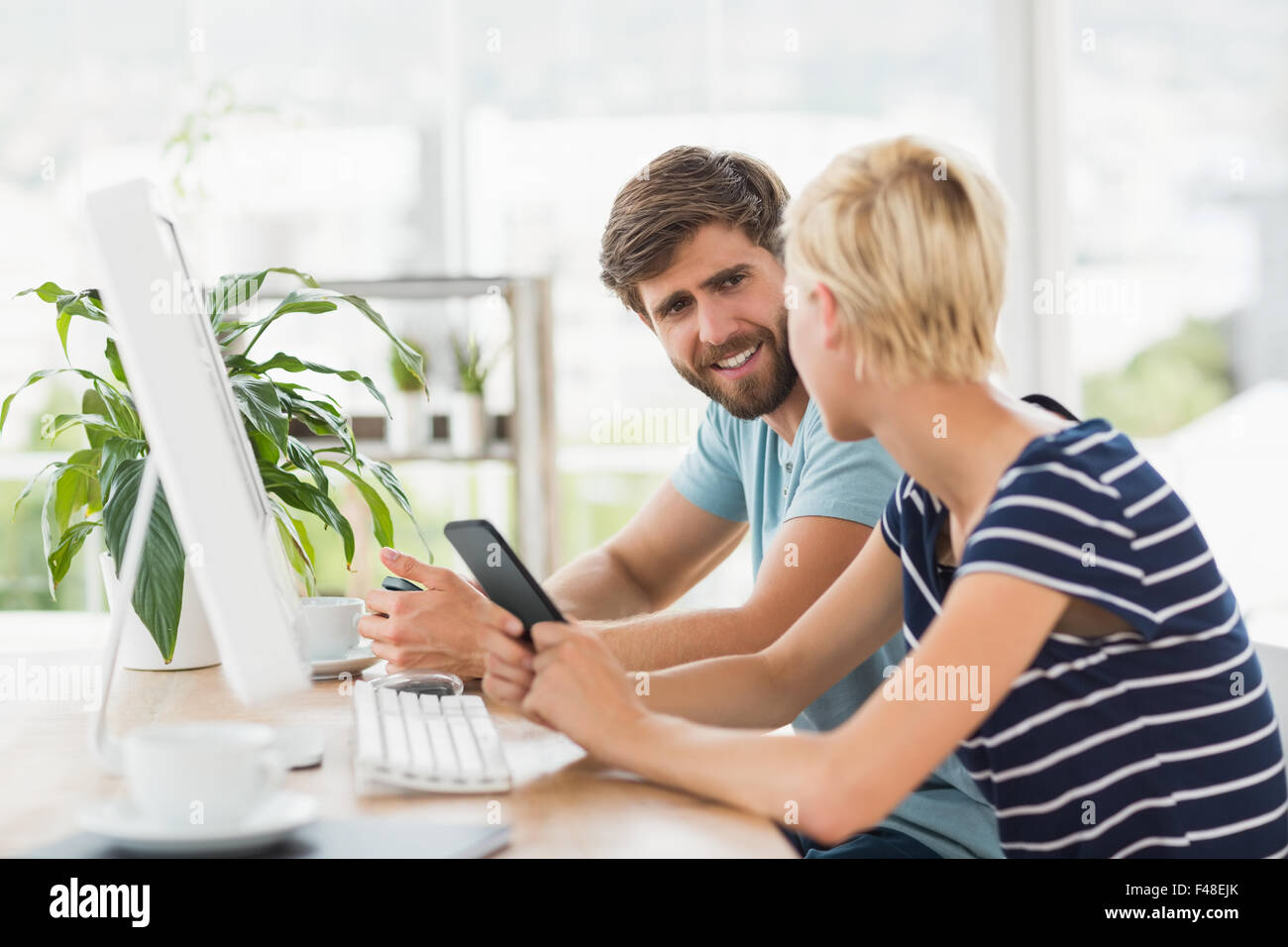 Creative business people working together on computer Stock Photo - Alamy