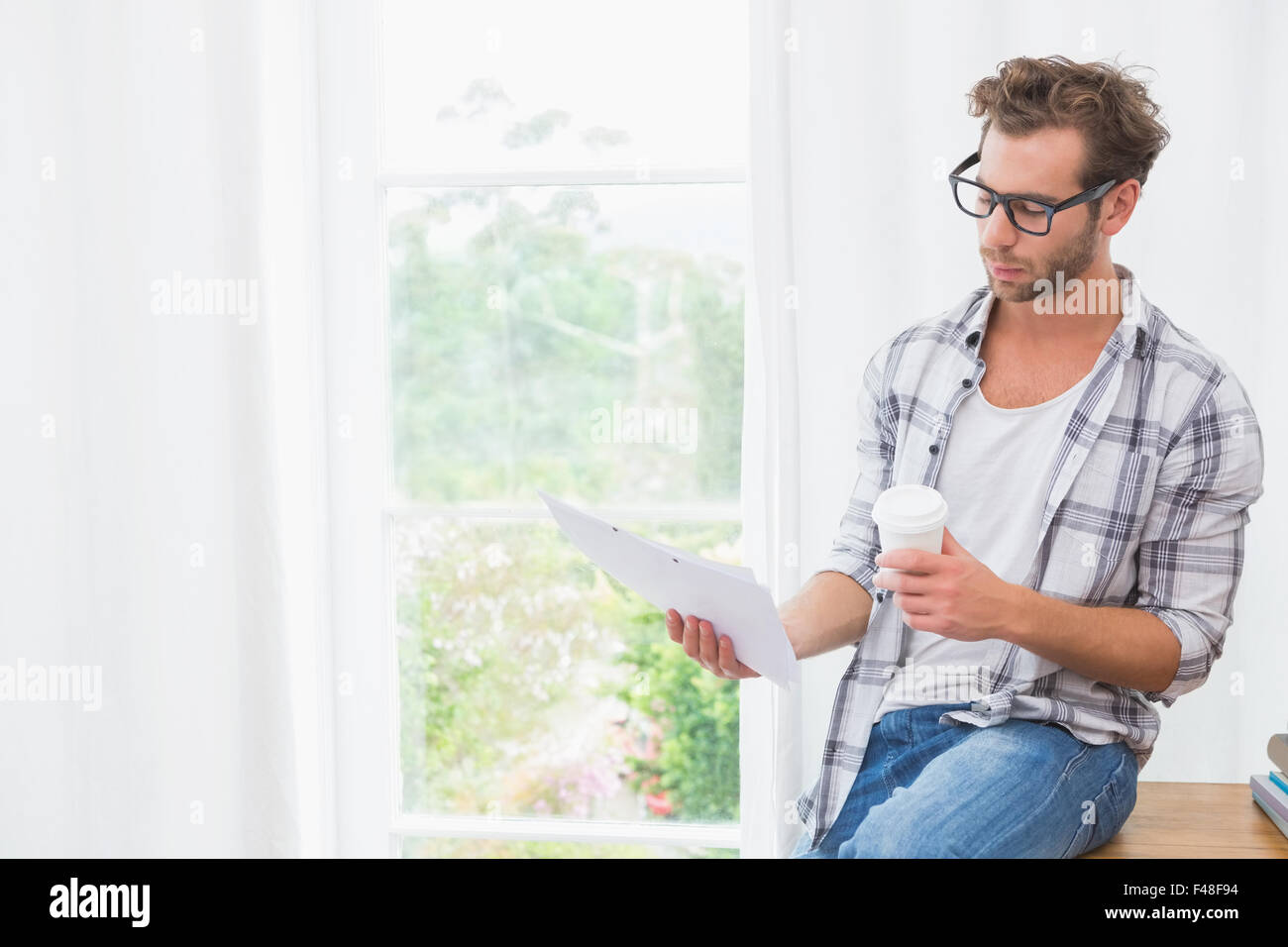 Serious handsome man reading paper Stock Photo - Alamy Serious handsome man reading paper Stock Photo - Alamy