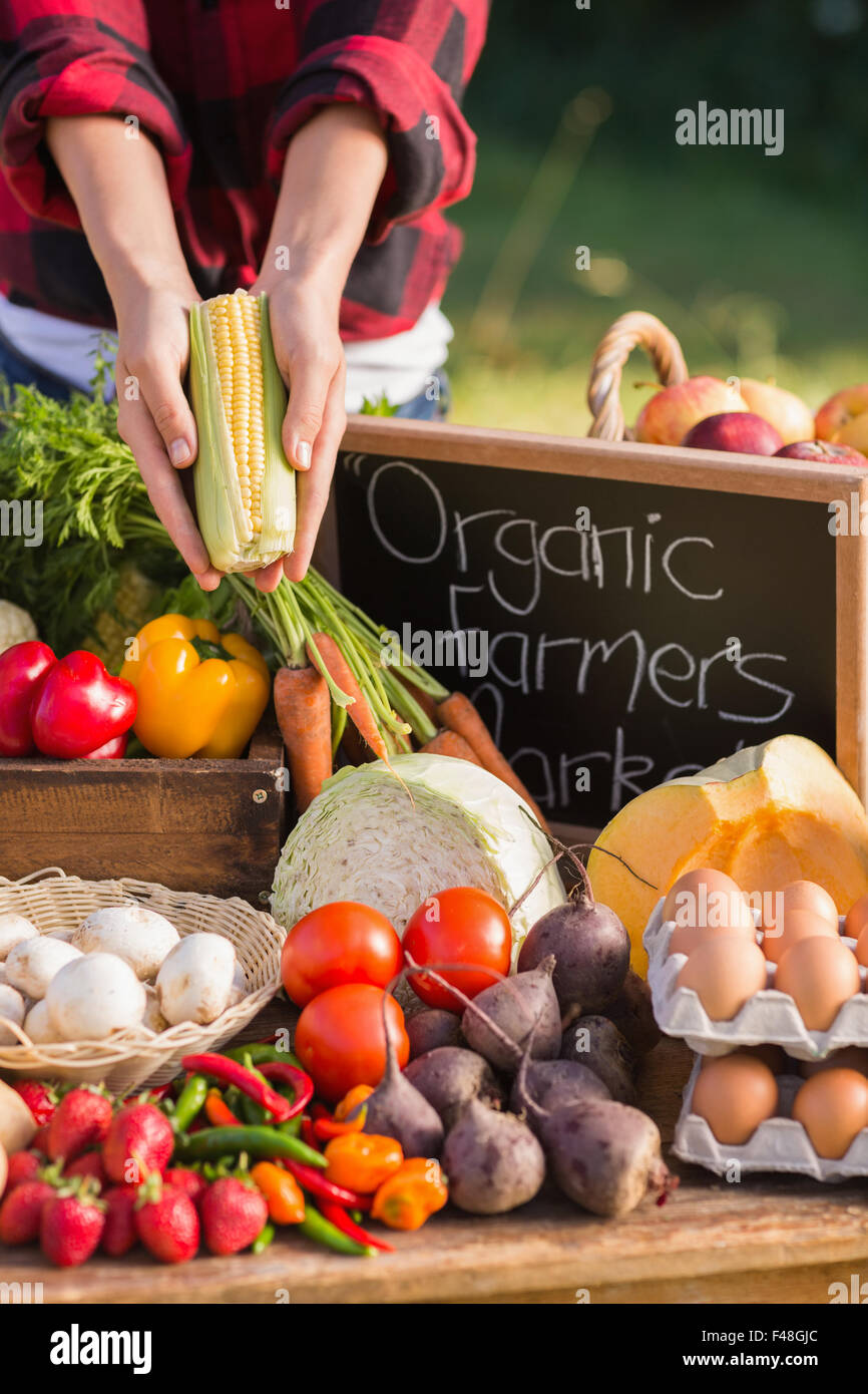 Woman selling organic vegetables Stock Photo - Alamy