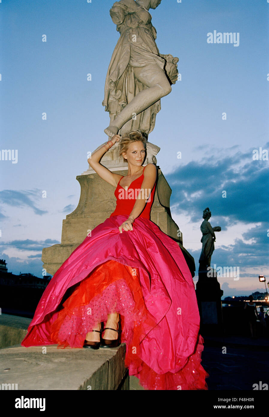 Woman dressed in an evening gown on a bridge, Florence, Italy Stock ...