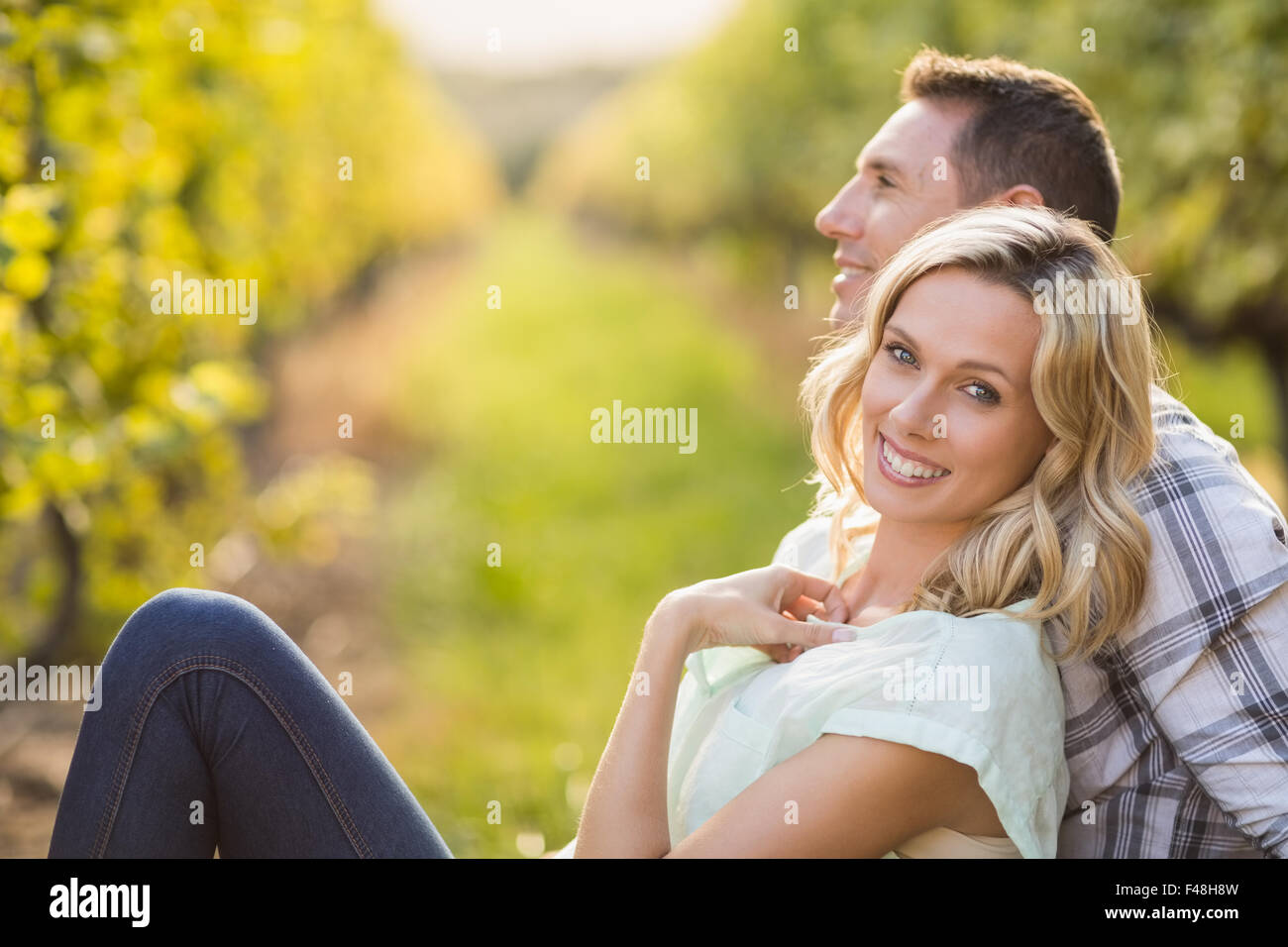 Portrait smiling couple sitting closely hi-res stock photography and ...
