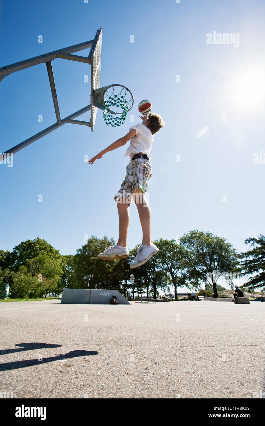 A boy playing basketball Stock Photo - Alamy