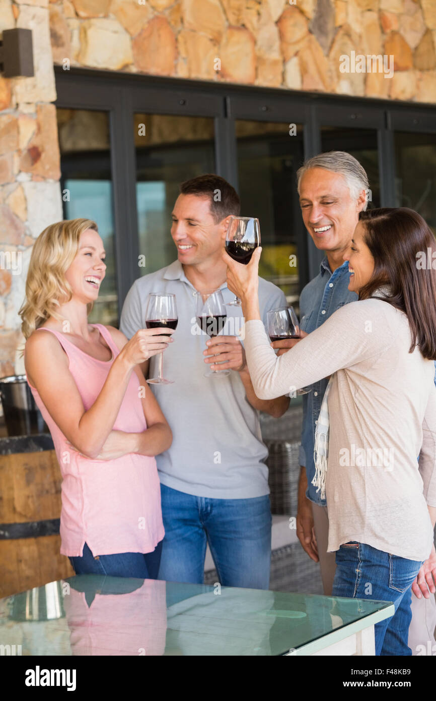 Happy friends in a wine tasting having wine Stock Photo - Alamy