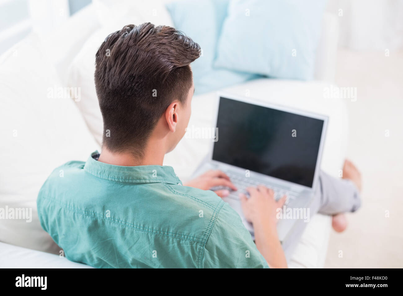 Back turned man typing on laptop Stock Photo - Alamy