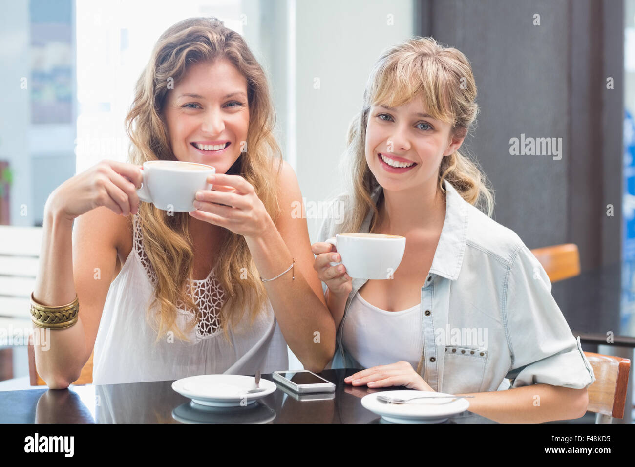 Beautiful women drinking coffee hi-res stock photography and images - Alamy