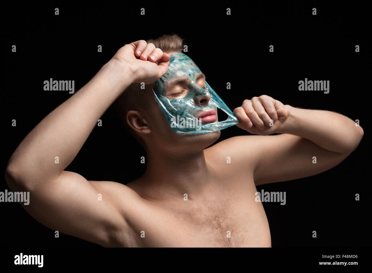 Man peeling off mask hi-res stock photography and images - Alamy