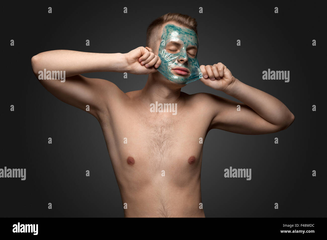 Man peeling off mask hi-res stock photography and images - Alamy