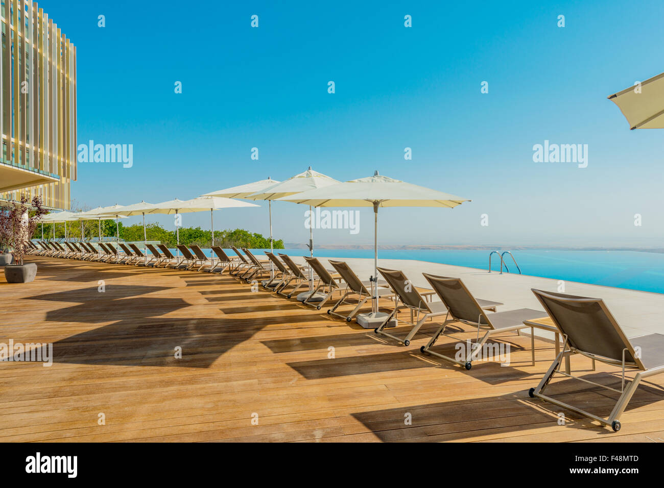 Infinity pool on the bright summer day Stock Photo - Alamy