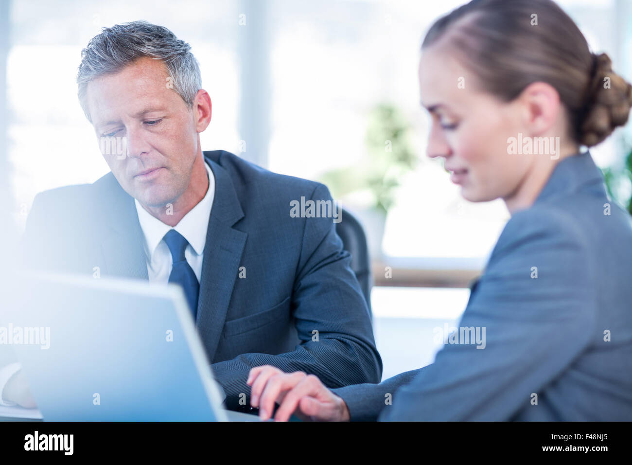 Serious business people working together Stock Photo - Alamy