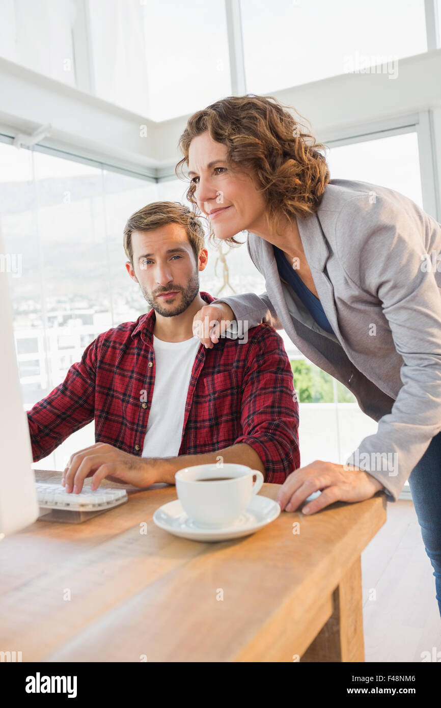 Creative business people working together on computer Stock Photo - Alamy