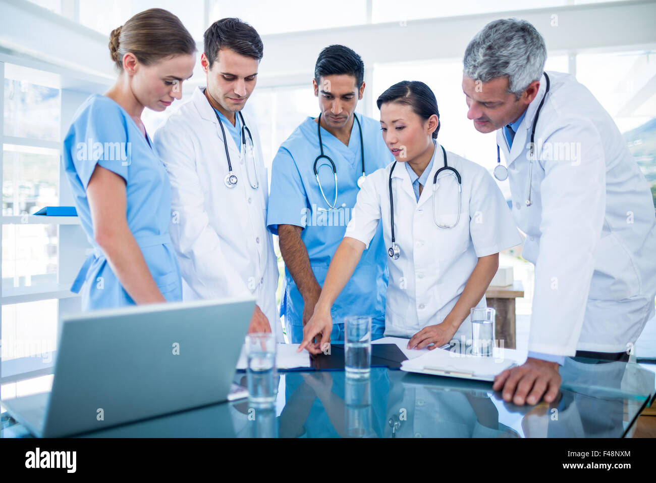 Doctors and nurses discussing together Stock Photo - Alamy