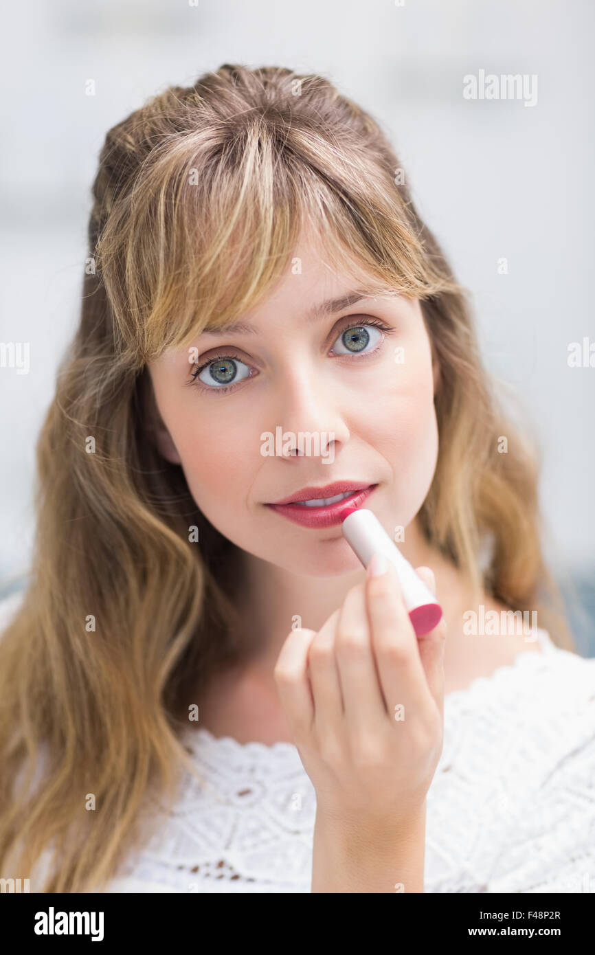 Beautiful costumer applying makeup Stock Photo - Alamy