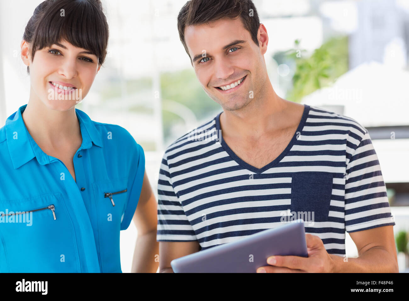 Professional team looking tablet screen hi-res stock photography and ...