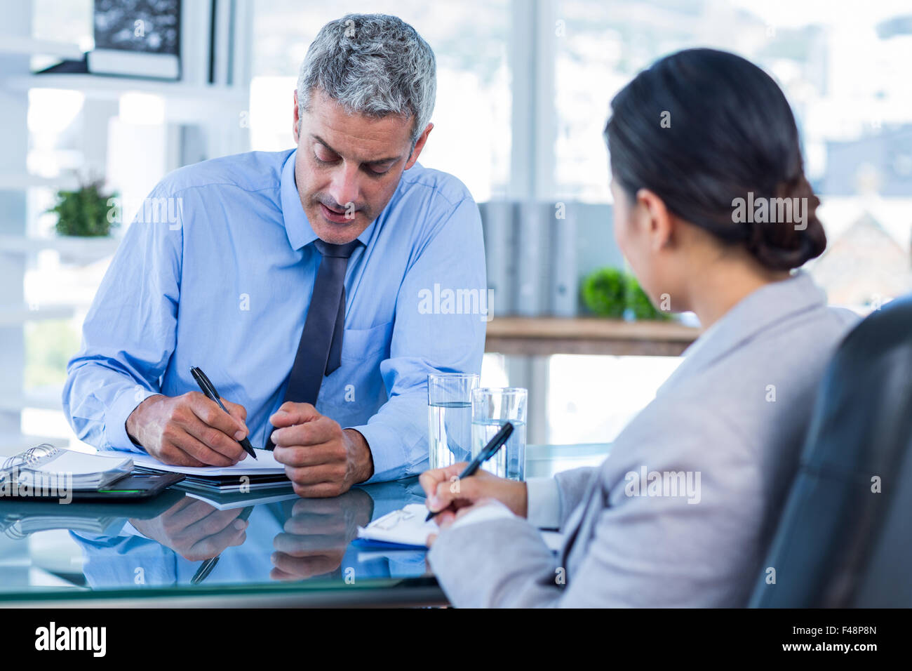Concentrated business people working together hi-res stock photography ...