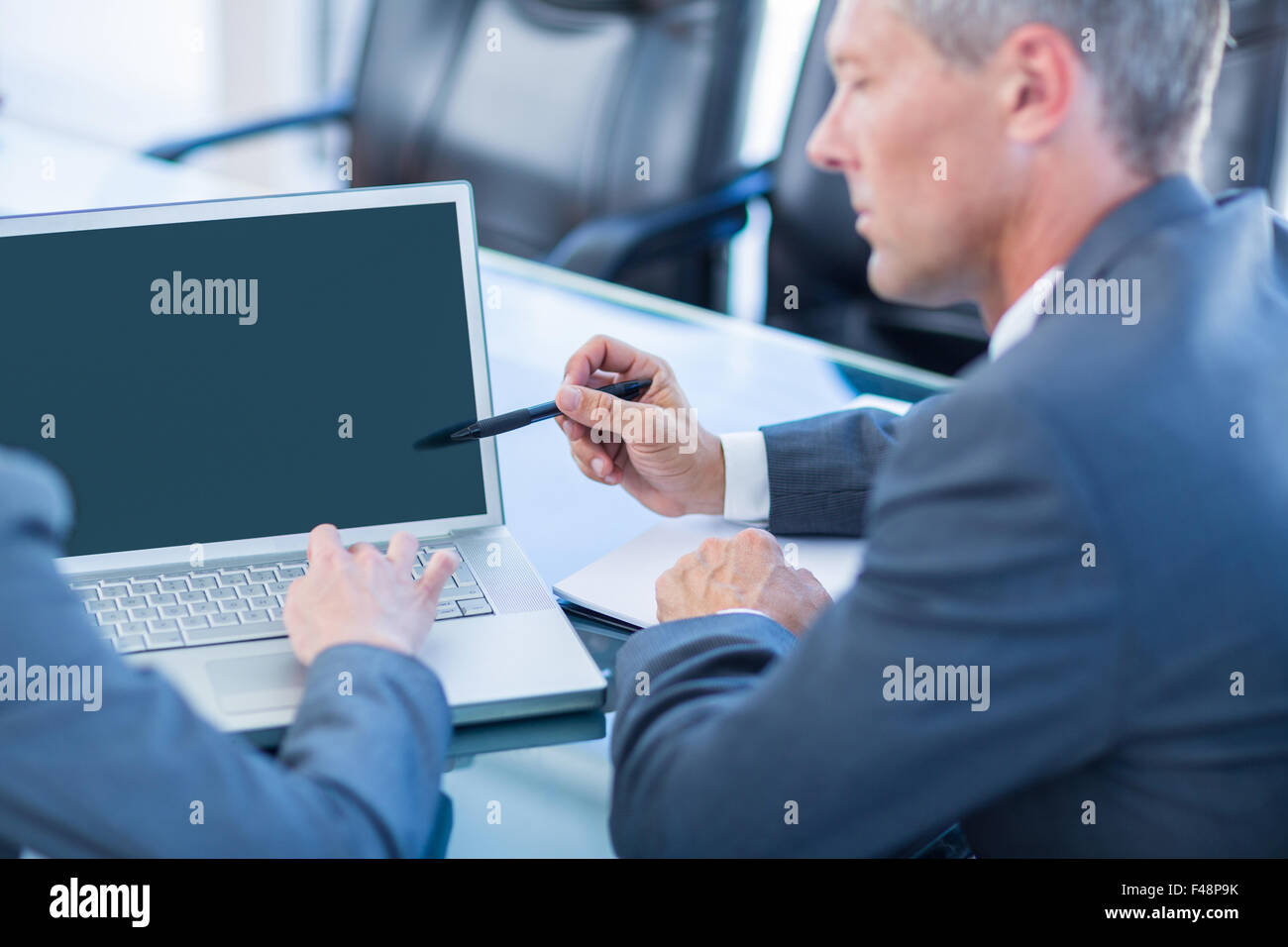 Business people working on laptop computer Stock Photo - Alamy