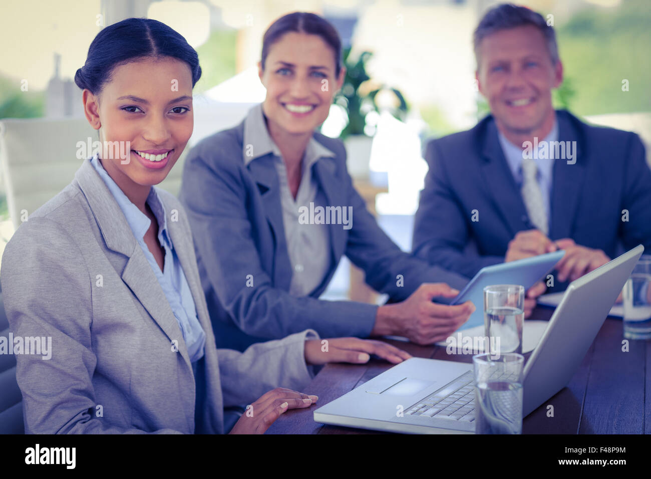 Business people looking at camera Stock Photo - Alamy