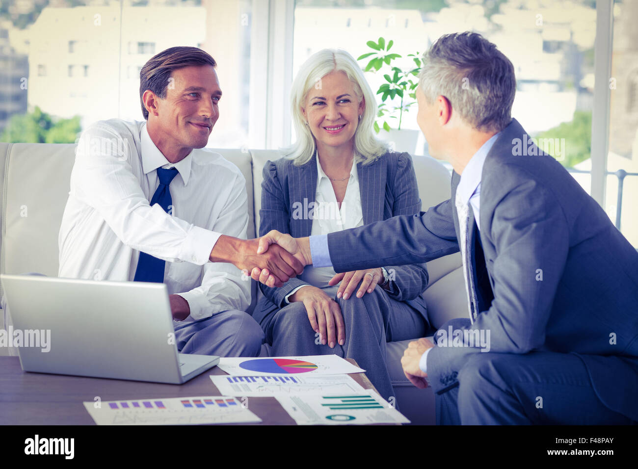 Reaching to shake hands hi-res stock photography and images - Alamy