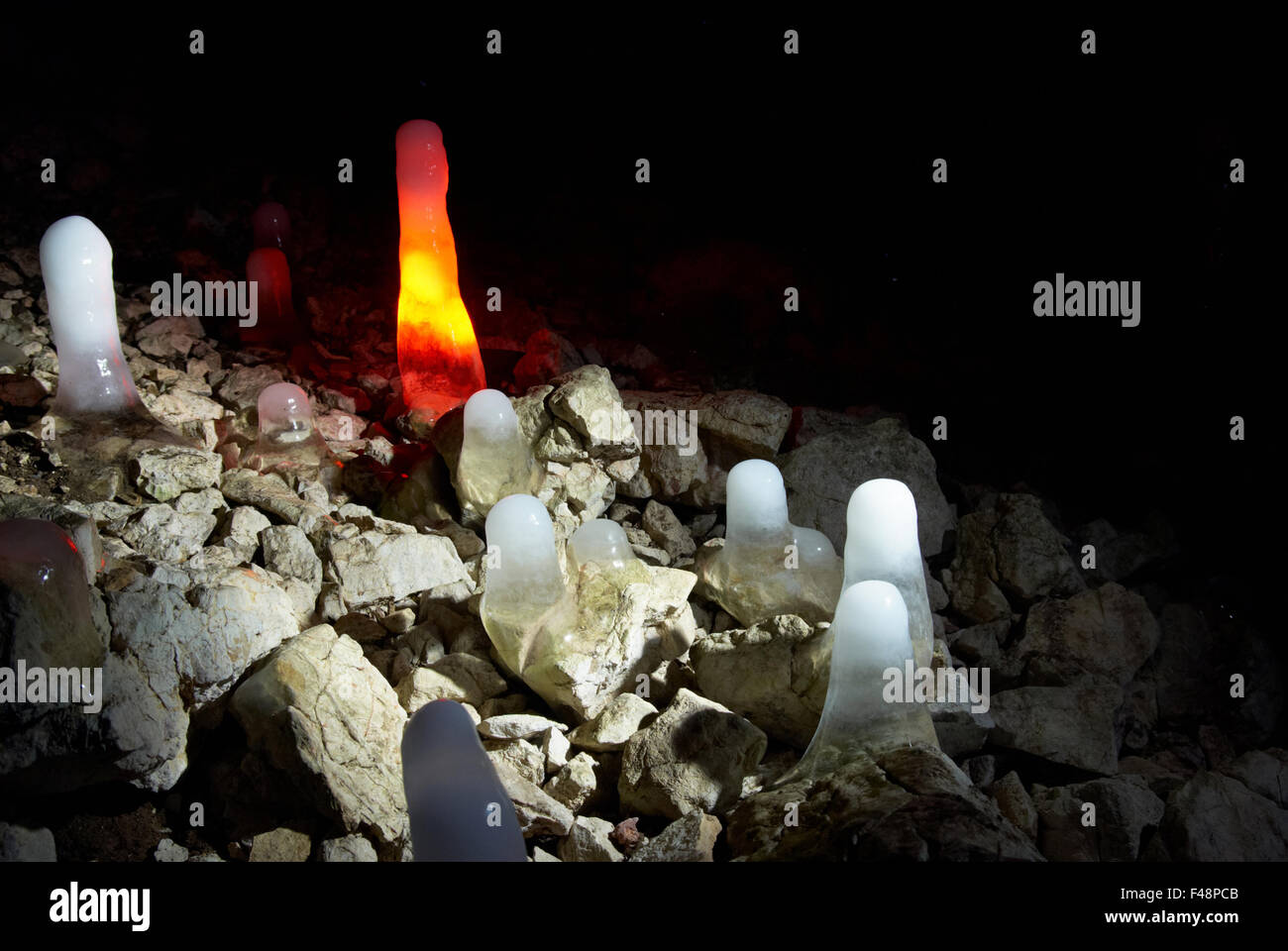 Multicolored ice stalagmites in the cave Stock Photo - Alamy