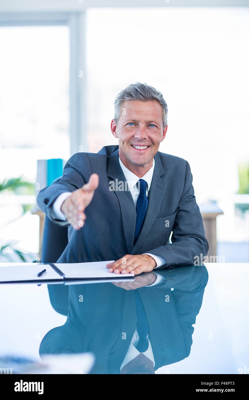 Businessman ready to shake hand Stock Photo - Alamy