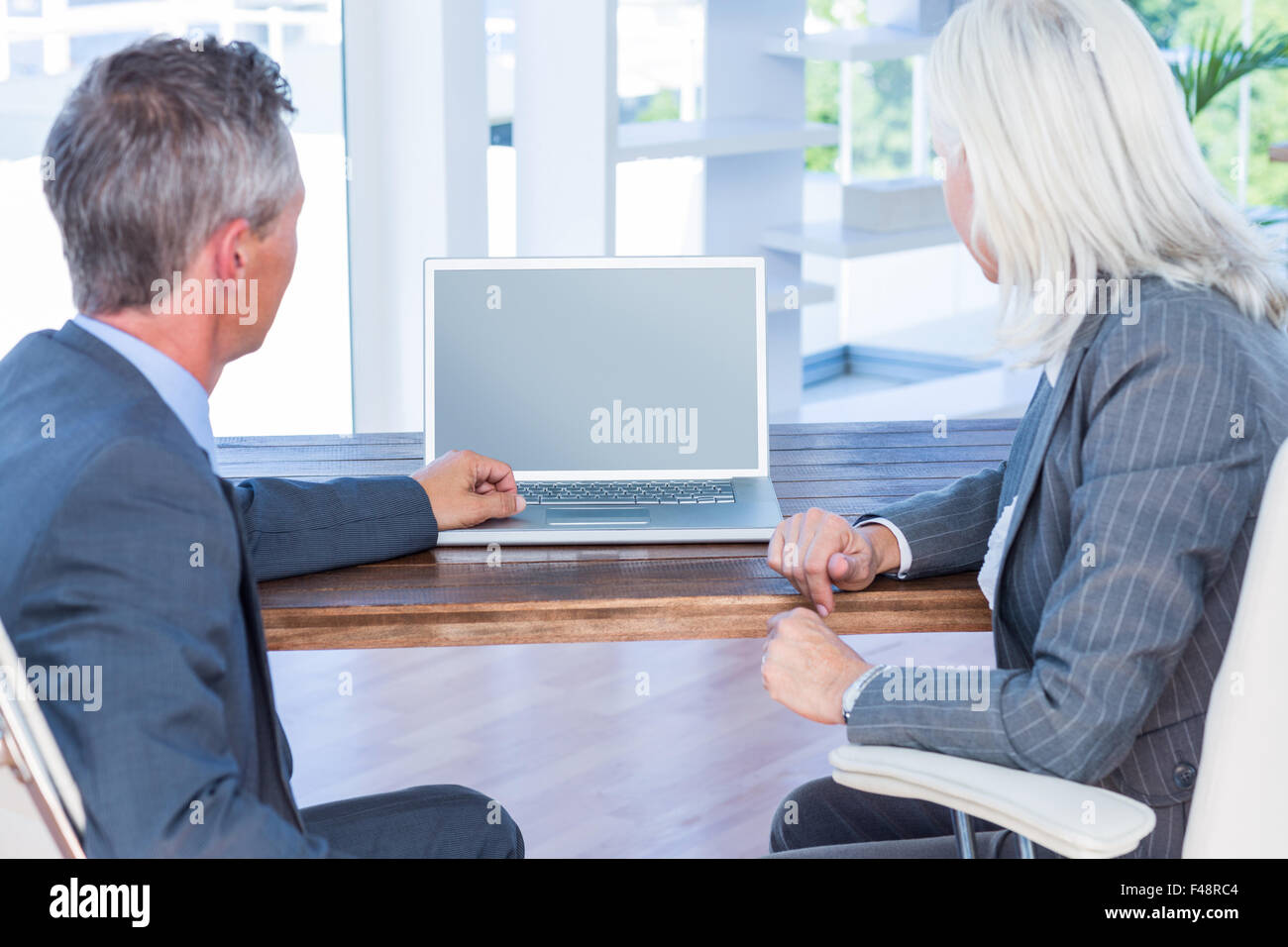 Business people working on laptop computer Stock Photo - Alamy