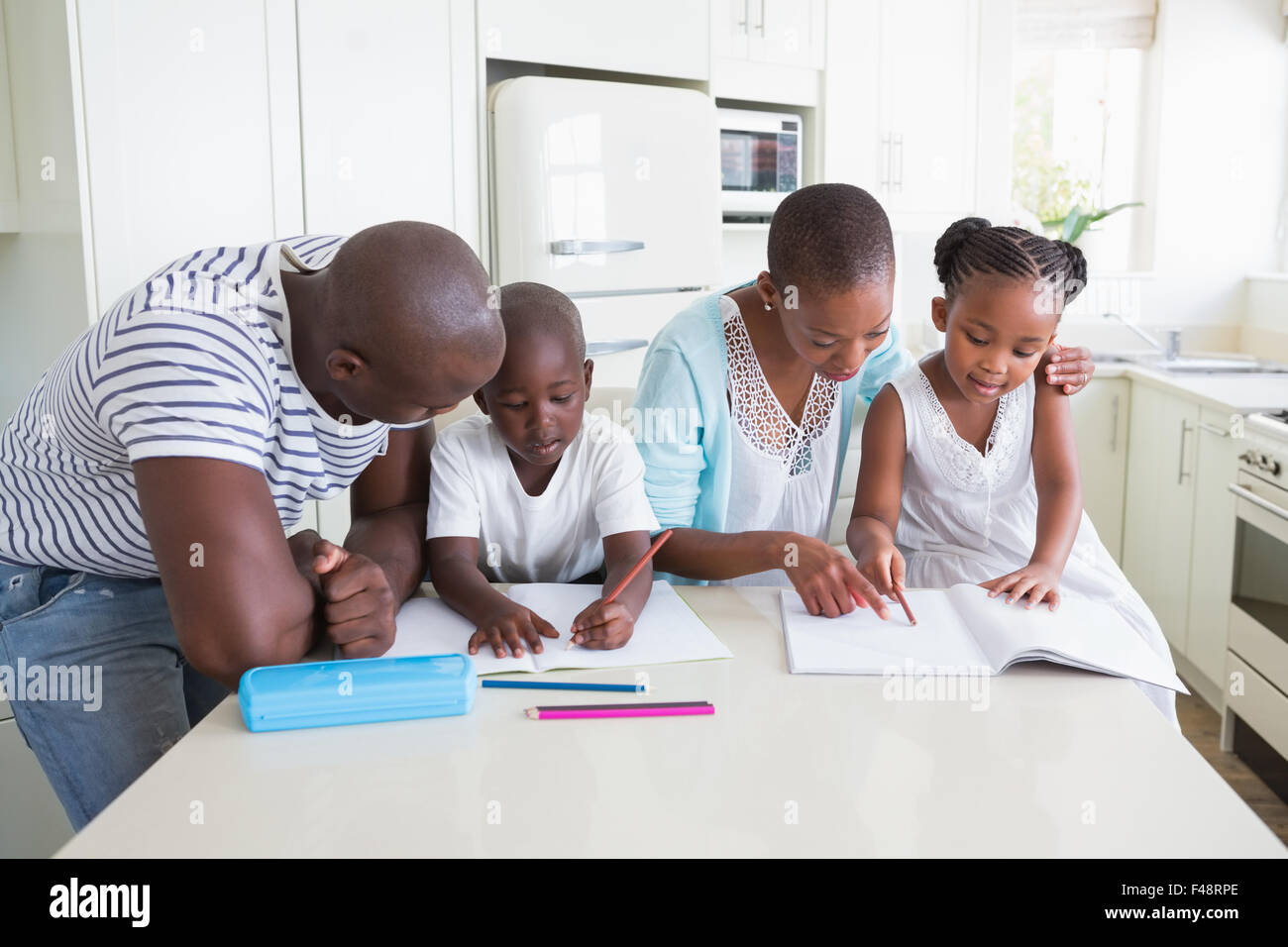 A happy family working together Stock Photo - Alamy