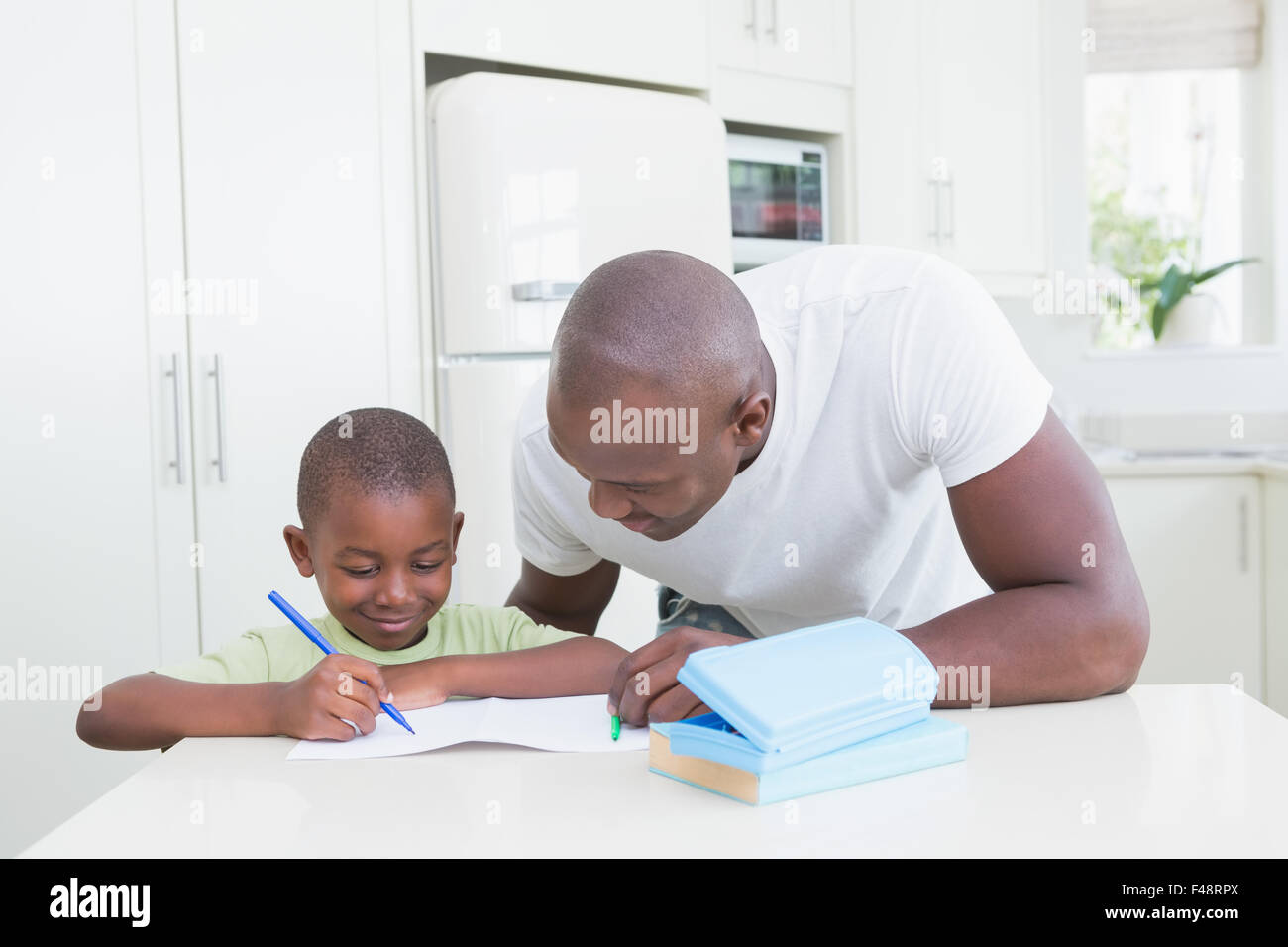 Father with his son working Stock Photo - Alamy